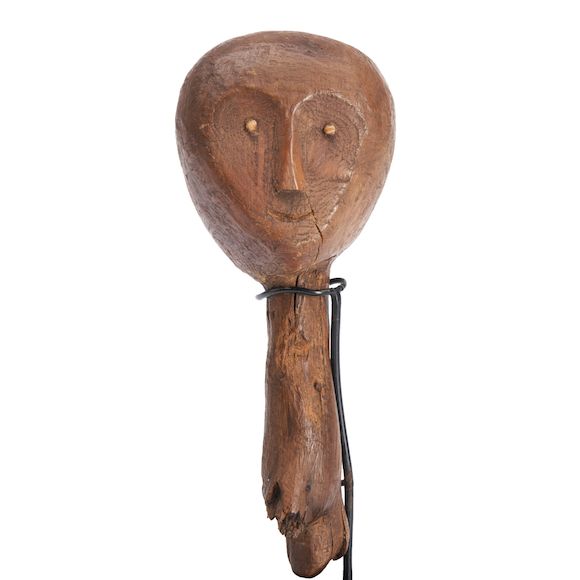 Bonhams Skinner : An Inuit wood Janus head ht. 7, wd. 2 1/2 in.