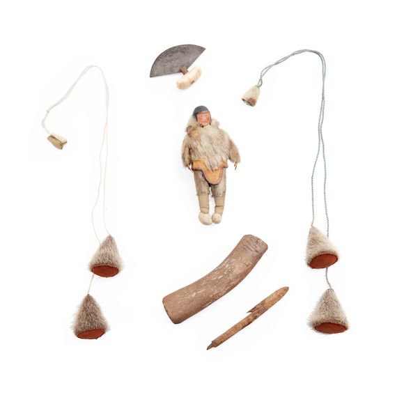 Bonhams Skinner : An Eskimo doll and toy bola ht. of doll 6 1/2, lg. of ...