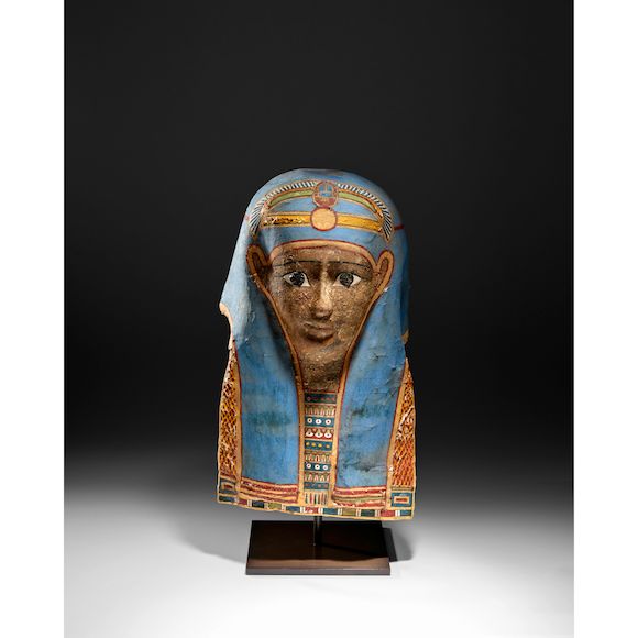 Bonhams : An Egyptian polychrome painted cartonnage mummy mask