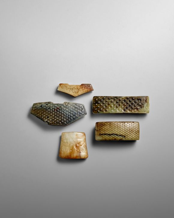 Bonhams : FIVE ARCHAISTIC JADE SWORD AND SCABBARD DECORATIONS Late Qing ...