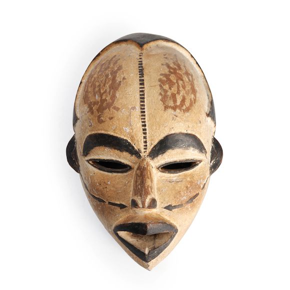 Bonhams Skinner : An Ibo face mask ht. 9 1/4, wd. 5 3/4 in.