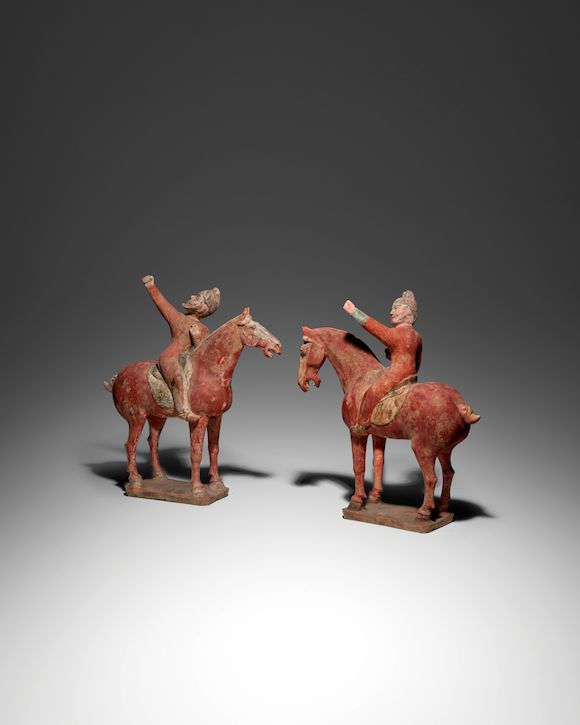 Bonhams : A PAIR OF PAINTED POTTERY MODELS OF ARCHERS ON HORSEBACK Tang ...