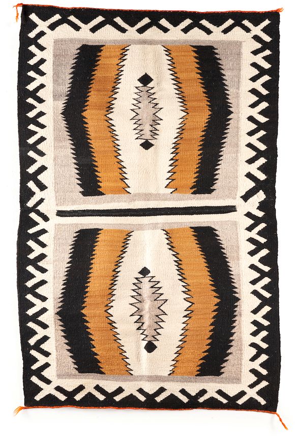 Bonhams Skinner : A Diné (Navajo) rug 52 x 34 in.