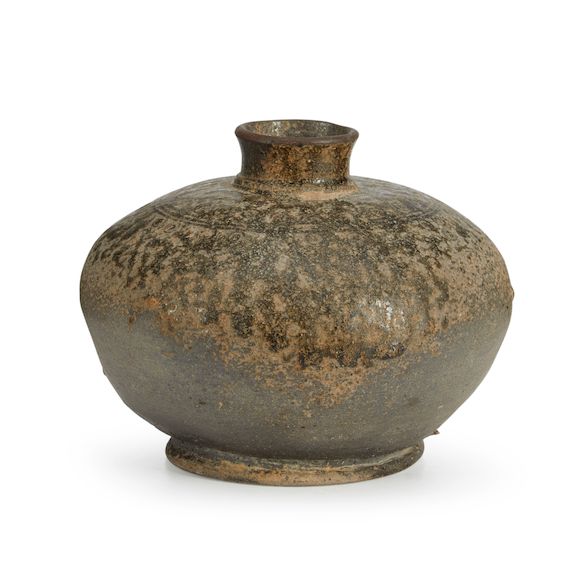 Bonhams Skinner : AN ASH-GLAZED STONEWARE BOTTLE-FORM BURIAL JAR