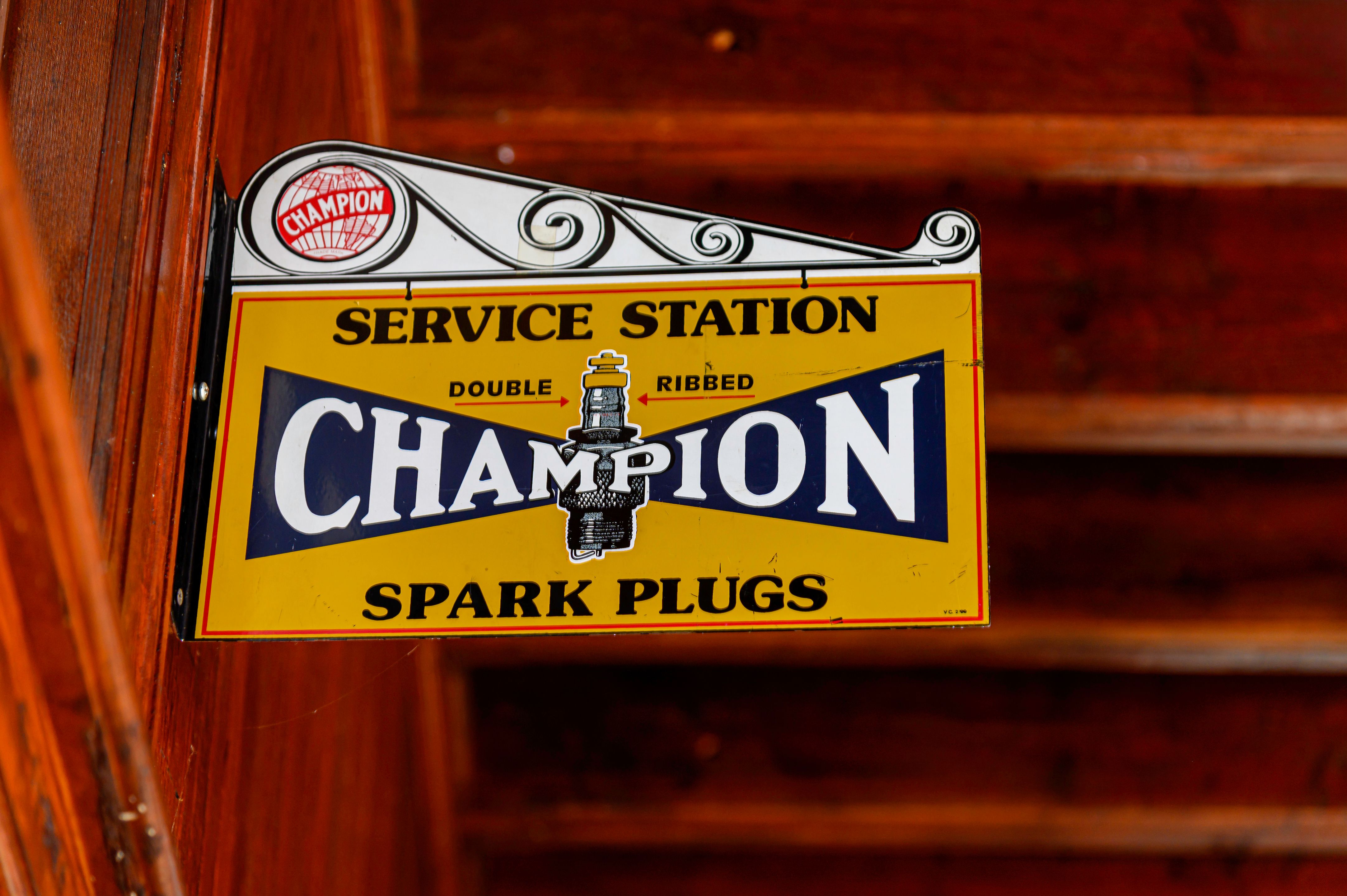 Bonhams Cars : A Champion Service Station Wall-Mounted Enamel Sign