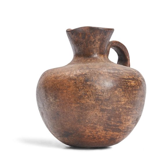 Bonhams Skinner : SMALL POTTERY NARROW-NECKED PITCHER