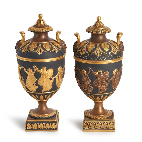 Bonhams Skinner : Two Wedgwood Bronze and Gilt Black Basalt Vases and Covers, England, late 19th ...