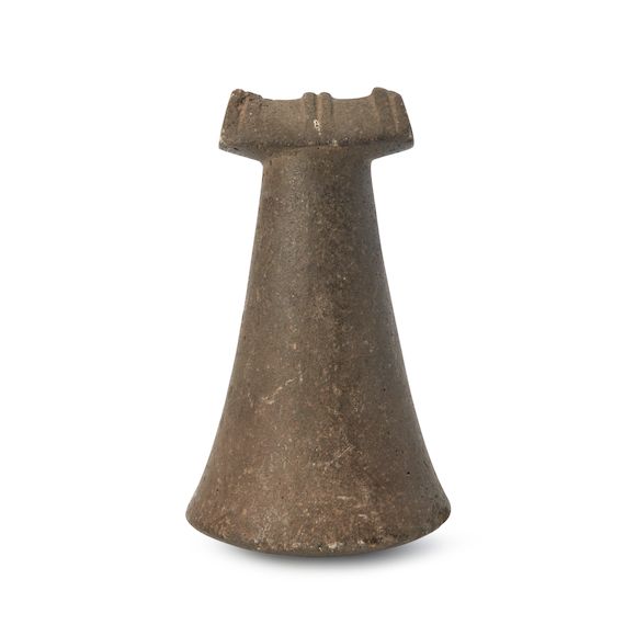 Bonhams Skinner : A Tahitain poi pounder ht. 6 1/4 in.
