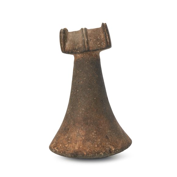Bonhams Skinner : A Tahitain poi pounder ht. 6 1/4 in.