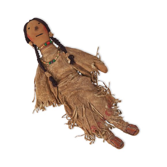 Bonhams Skinner : A Plains beaded hide doll lg. 19 1/4 in.