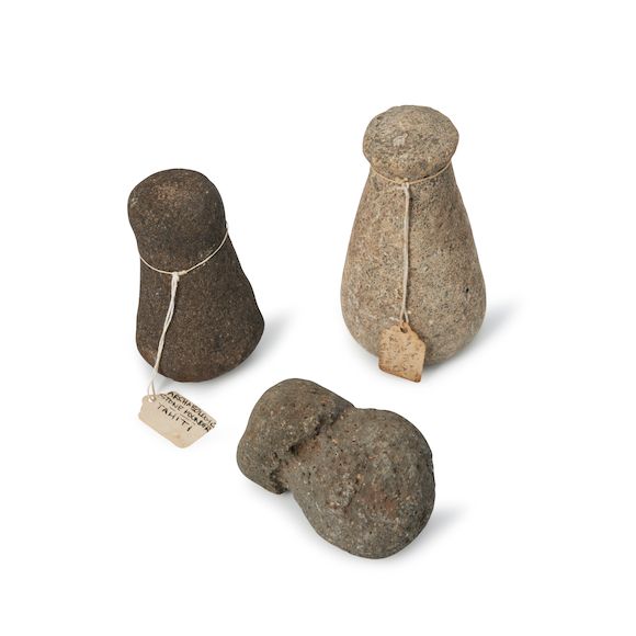 Bonhams Skinner : Two Tahitian stone pounders and sinker ht. 5, 4, and ...