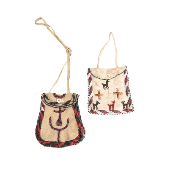 Bonhams Skinner : Two Apache beaded hide pouches 5 3/4 x 5, and 4 3/4 x 4 1/2 in.
