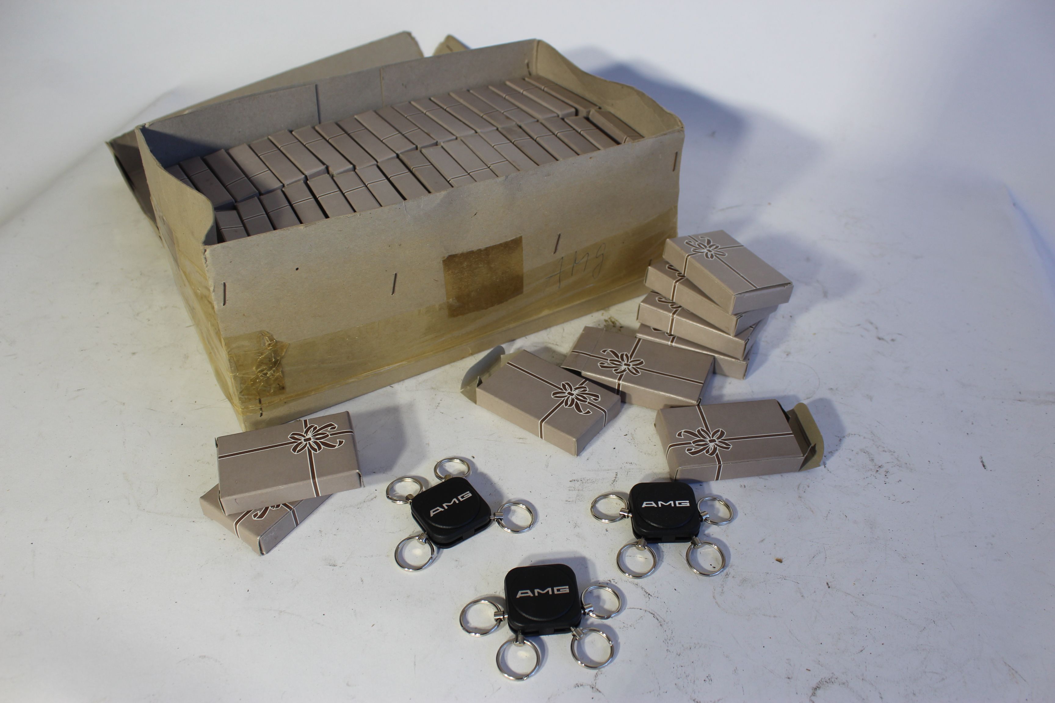 Bonhams Cars : A large quantity of NOS, AMG keychains,