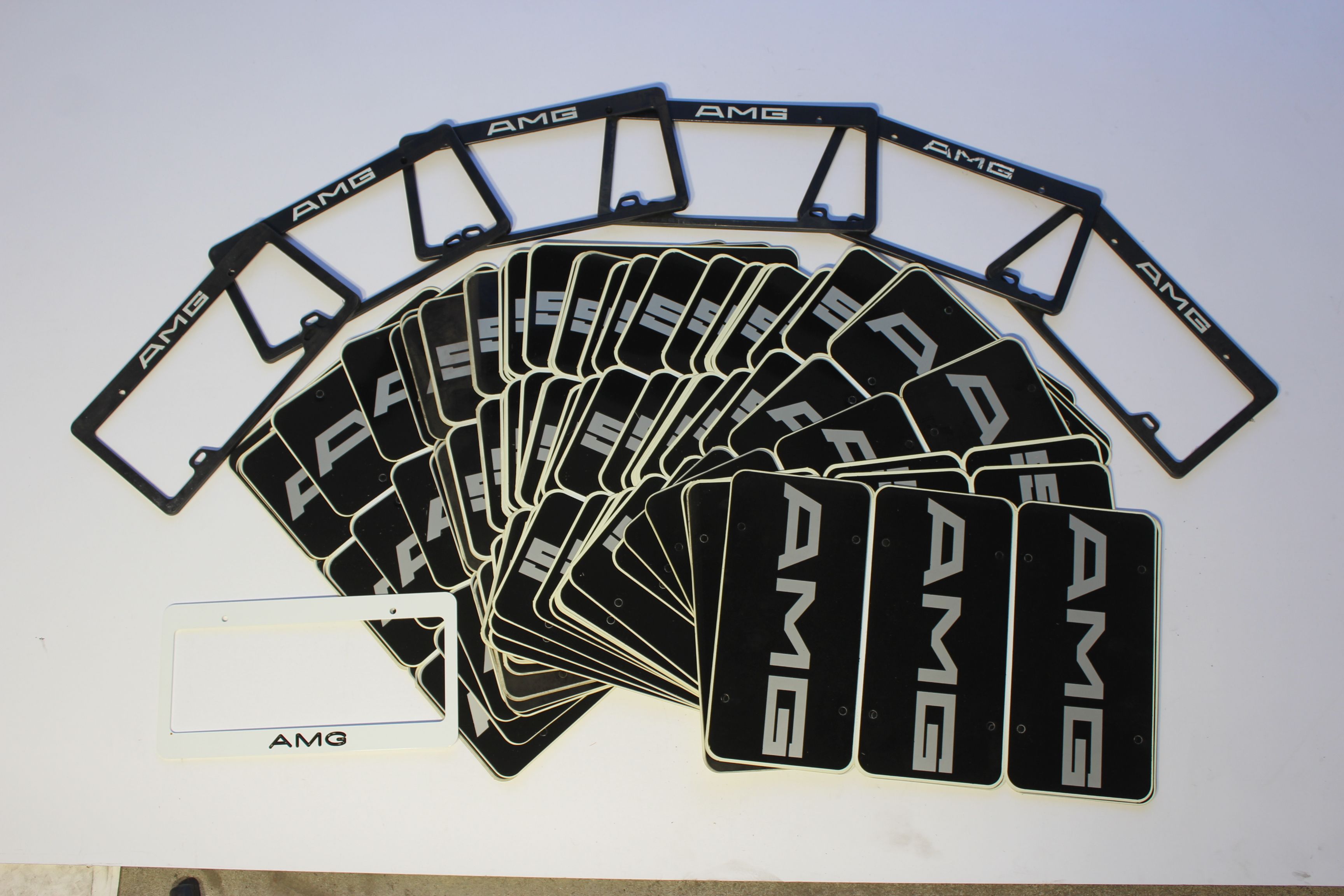 Bonhams Cars : A quantity of plastic AMG licence plates together with ...