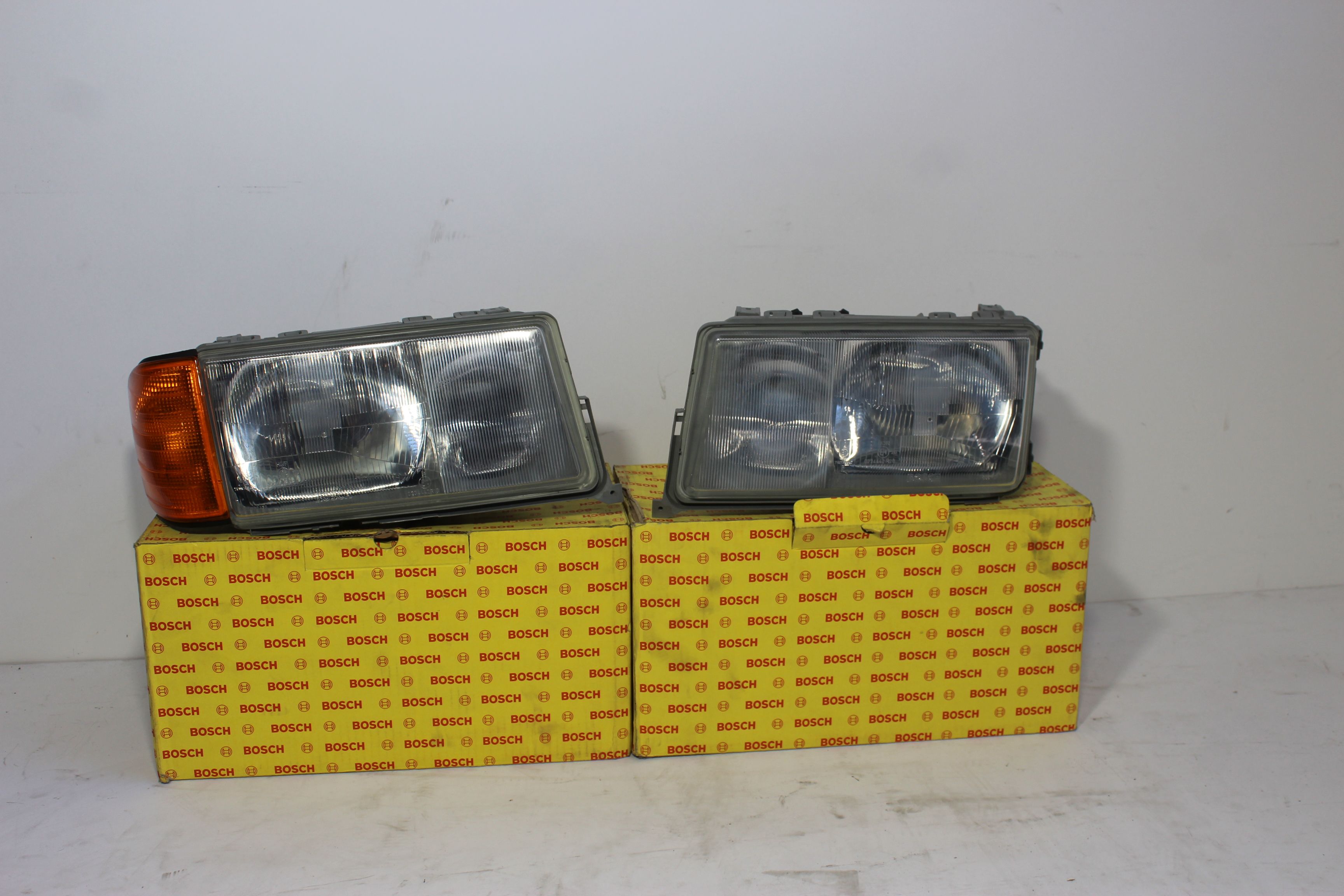 Bonhams Cars : An NOS, Euro Spec Bosch headlights for a Mercedes-Benz W201,