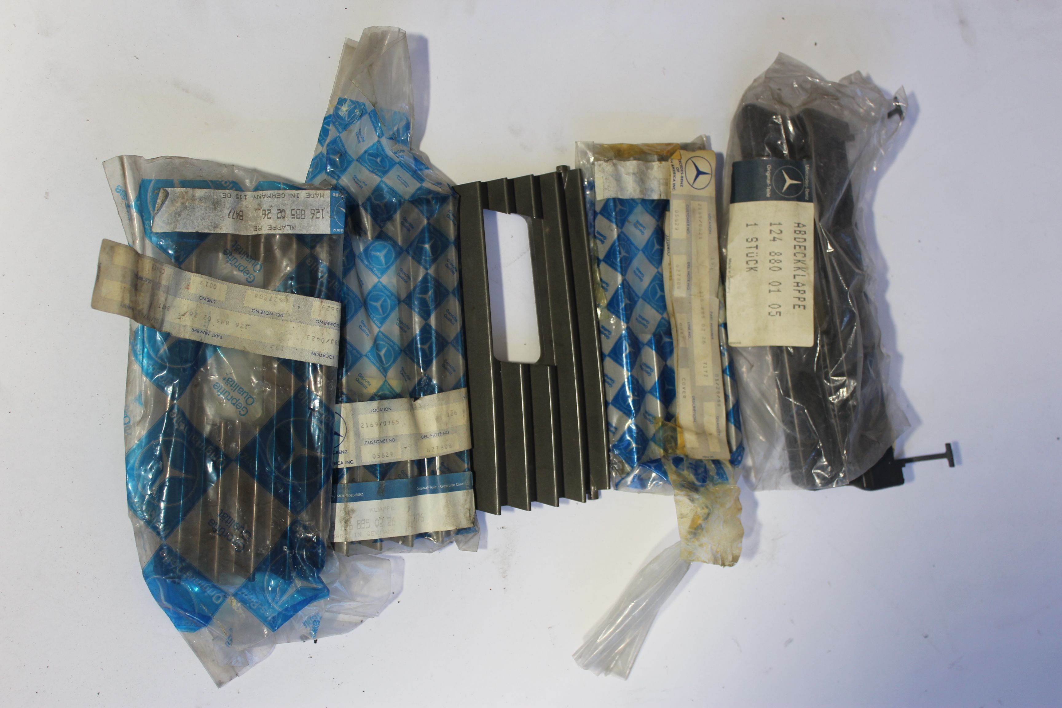 Bonhams Cars : 5, NOS, OEM, Mercedes-Benz tow hook covers,