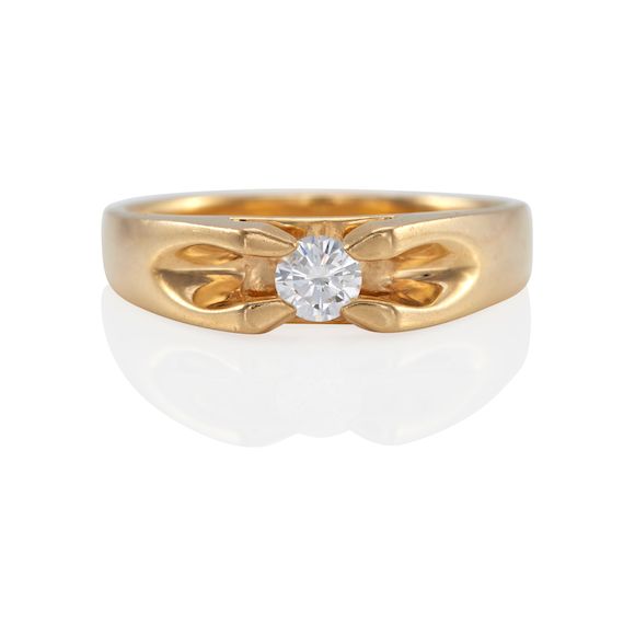 Bonhams : MAGIC GLO 14K GOLD AND DIAMOND RING