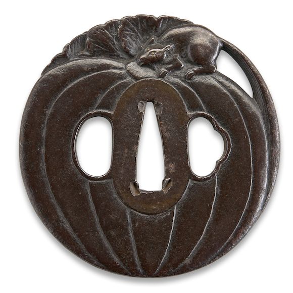 Bonhams Skinner : AN IRON CHOSHU SCHOOL TSUBA WITH A SQUIRREL ON ...