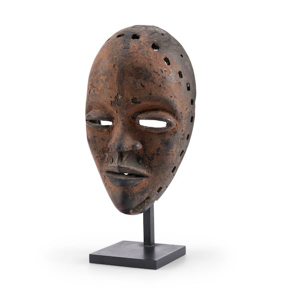 Bonhams Skinner : A Dan face mask ht. 9 1/2, wd. 6 in.