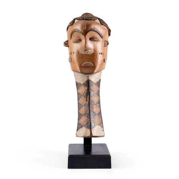 Bonhams Skinner : A Wongo mask ht. 18 in.