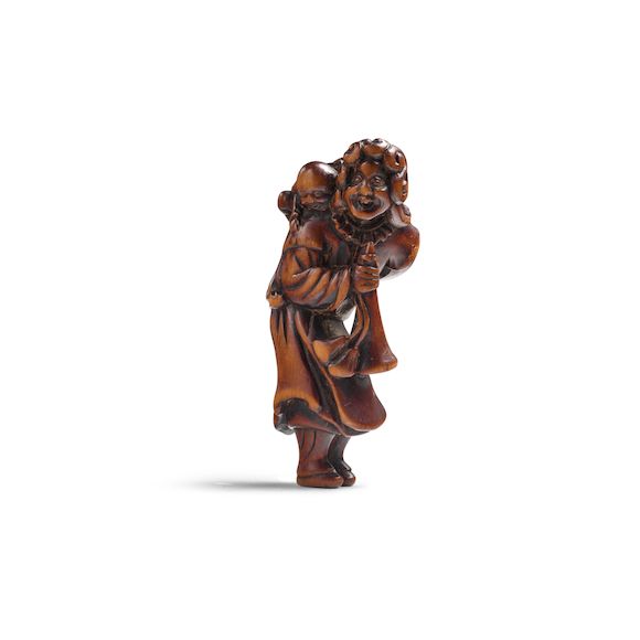 Bonhams : A WOOD NETSUKE OF A DUTCHMAN WITH A CHILD Edo period (1615 ...