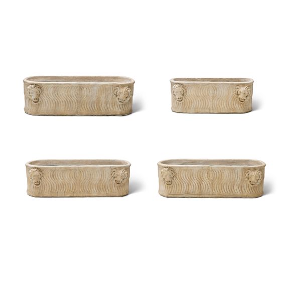 Bonhams : FOUR ROMAN STYLE COMPOSITION PLANTERS