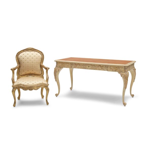 Bonhams : AN ITALIAN ROCOCO STYLE CARVED GILTWOOD DESK AND SIMILAR CHAIR