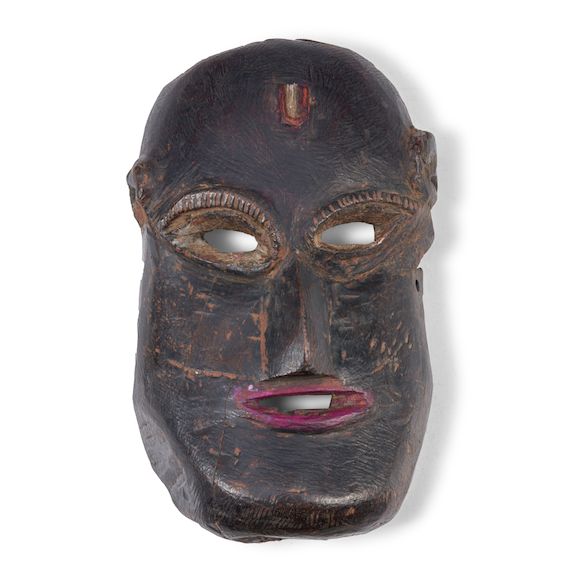 Bonhams Skinner : A Nepal tribal mask ht. 10, wd. 6 in.