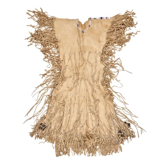 Bonhams Skinner : A Plains beaded hide dress lg. including fringe 48 in.