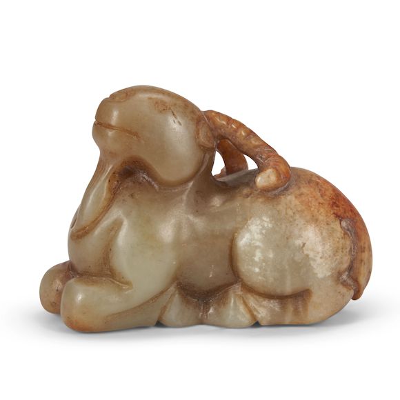 Bonhams Skinner : A CELADON AND RUSSET JADE RAM 20th century
