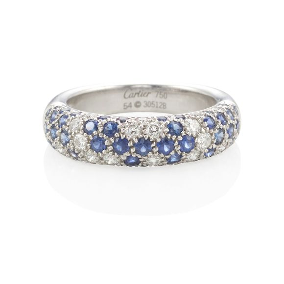 Bonhams : CARTIER: AN 18K WHITE GOLD, DIAMOND AND SAPPHIRE 'MIMI' RING