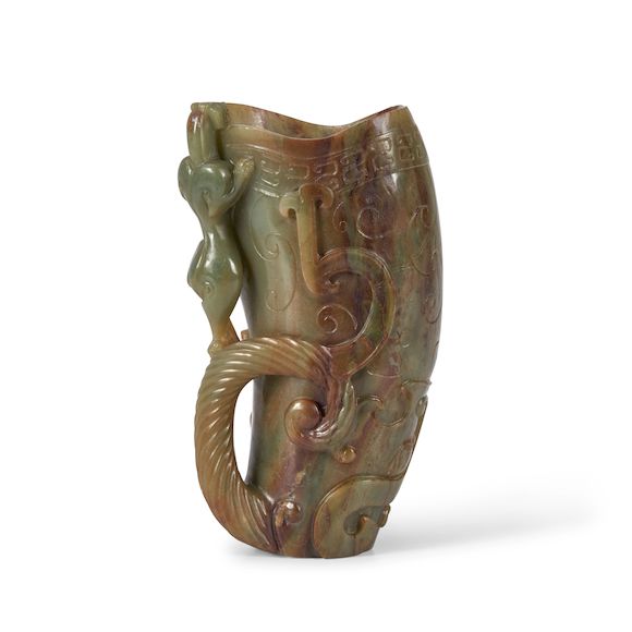 Bonhams Skinner : AN OLIVE GREEN JADE RHYTON CUP WITH STYLIZED CHILONG ...