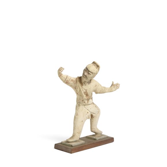 Bonhams : A PAINTED POTTERY FIGURE OF A GROOM WITH OUTSTRETCHED ARMS ...