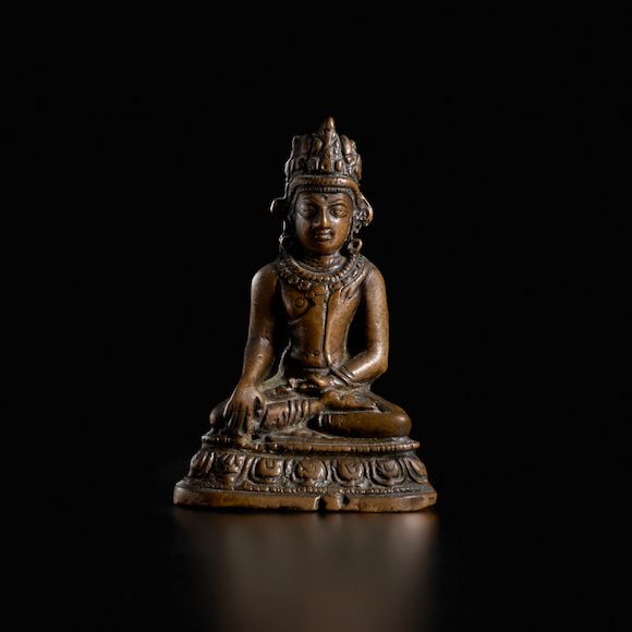 Bonhams : A COPPER ALLOY FIGURE OF CROWNED BUDDHA NORTHEASTERN INDIA ...