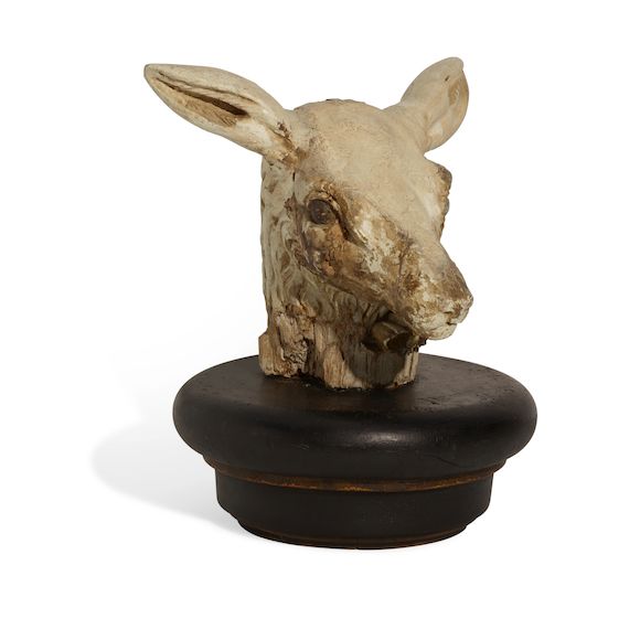 Bonhams : A CONTINENTAL WHITE PAINTED PARCEL GILT CARVED LAMB HEAD19th ...