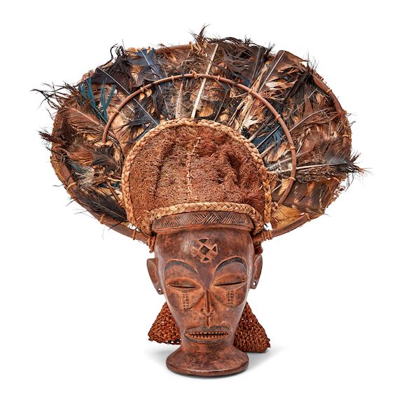 Bonhams Skinner : A Chokwe mask, Cihongo ht. 18 1/2, wd. 15 in.