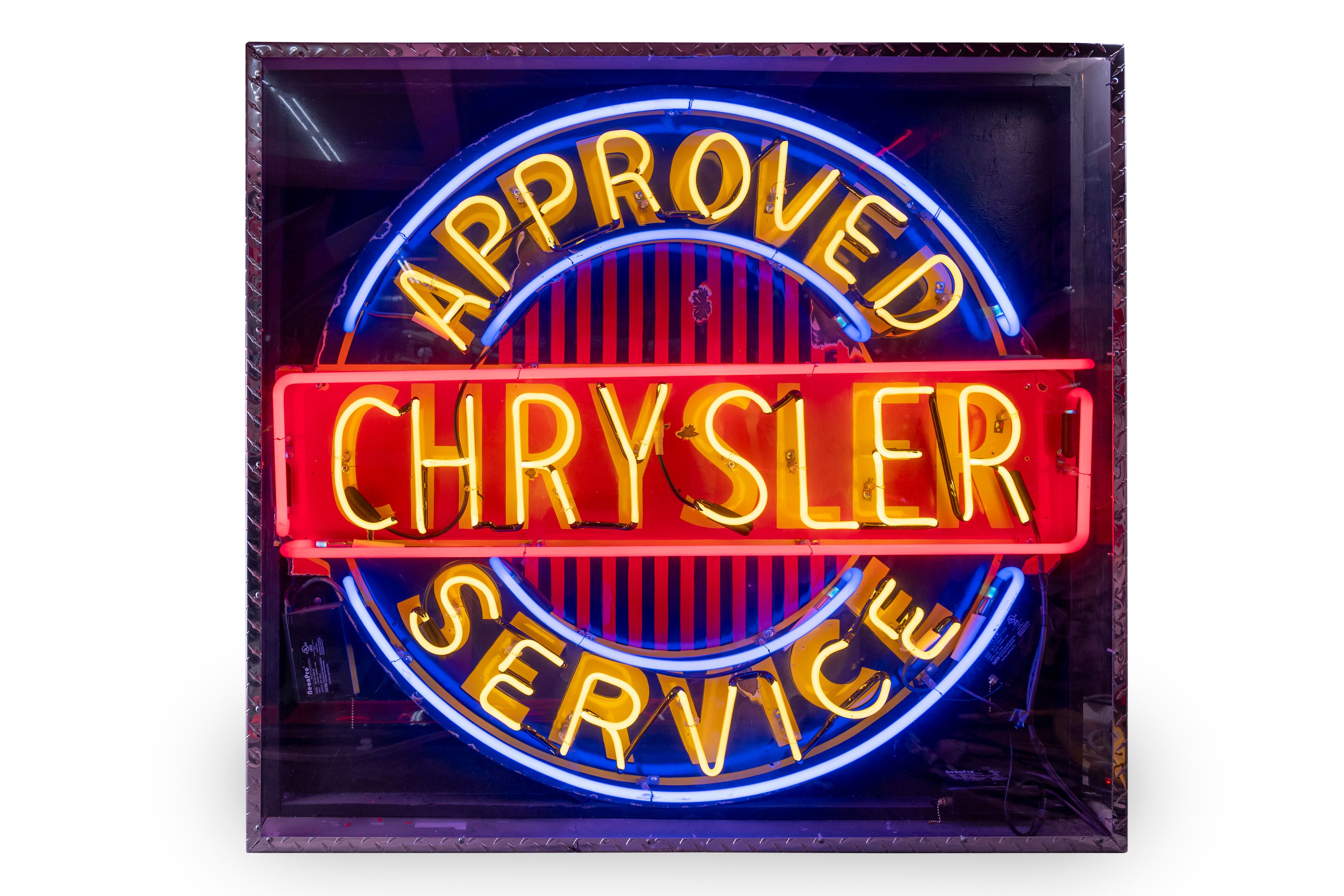 Bonhams Cars : An Approved Chrysler Service porcelain sign with neon added,