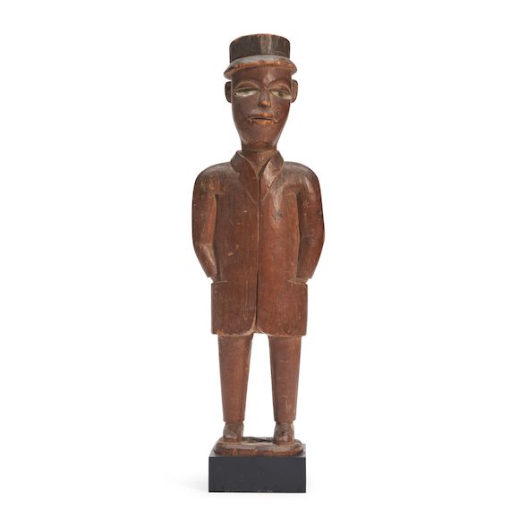 Bonhams Skinner : CARVED COLONIAL FIGURE