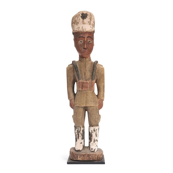Bonhams Skinner : CARVED AND PAINTED COLONIAL FIGURE