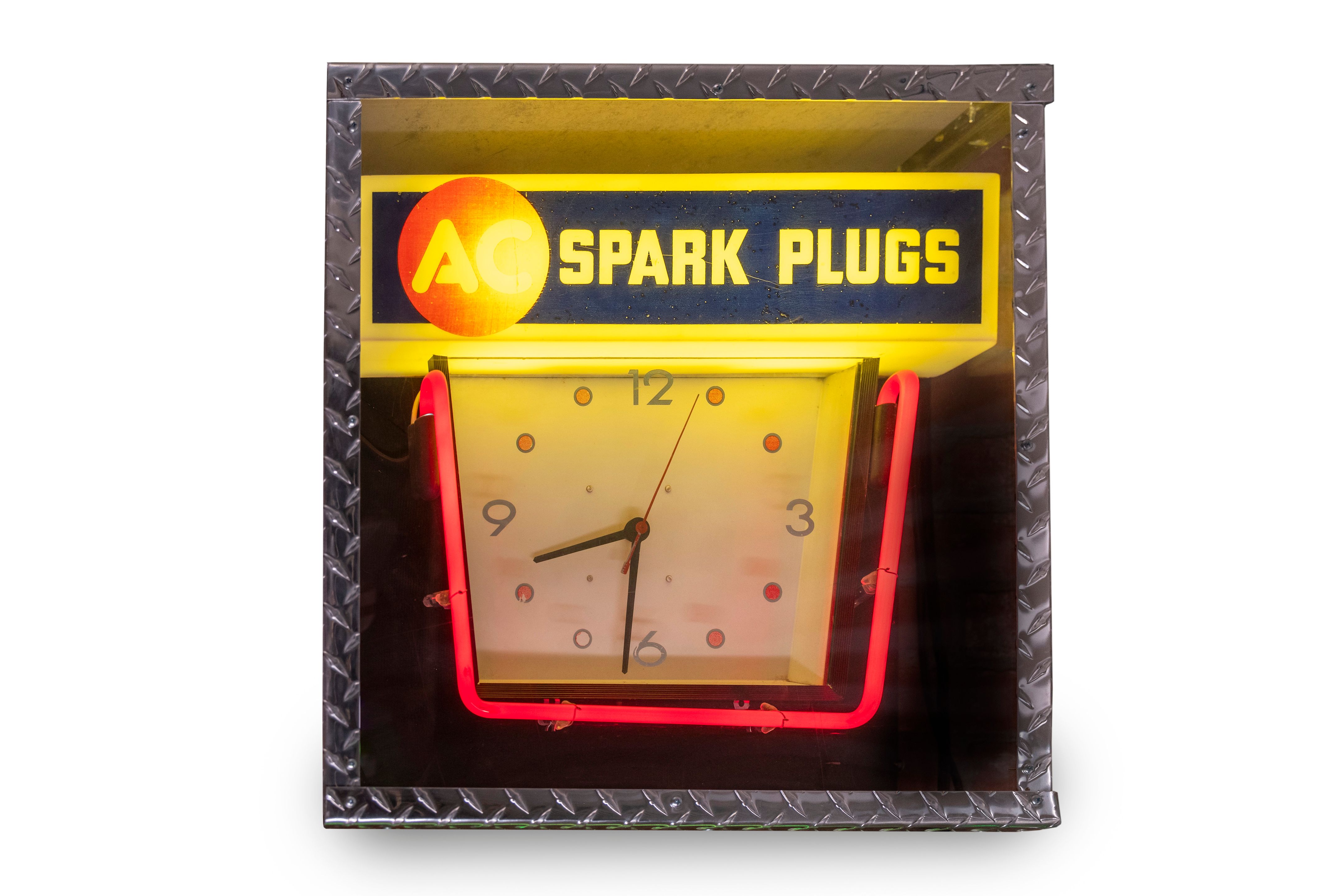 Bonhams Cars : An AC Spark Plugs illuminated neon-added clock,
