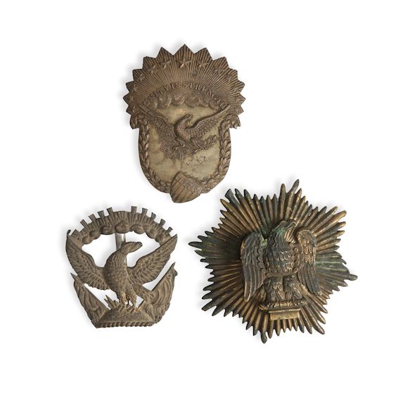 Bonhams Skinner : THREE AMERICAN MILITARY CAP PLATES,