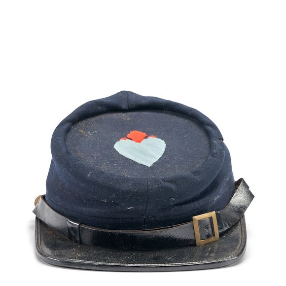 Bonhams Skinner : A CIVIL WAR FORAGE CAP WITH TWO CORPS BADGES.