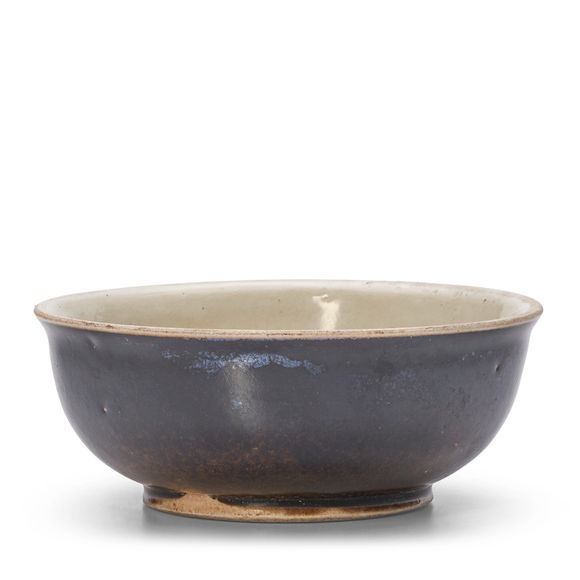 Bonhams : A SMALL HENAN BLACK AND CREAM-GLAZED DEEP BOWL Tang Dynasty